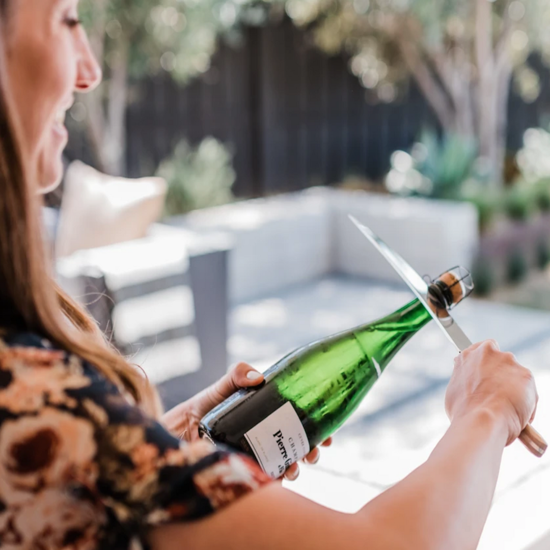How to Saber a Bottle of Champagne | We Drink Bubbles